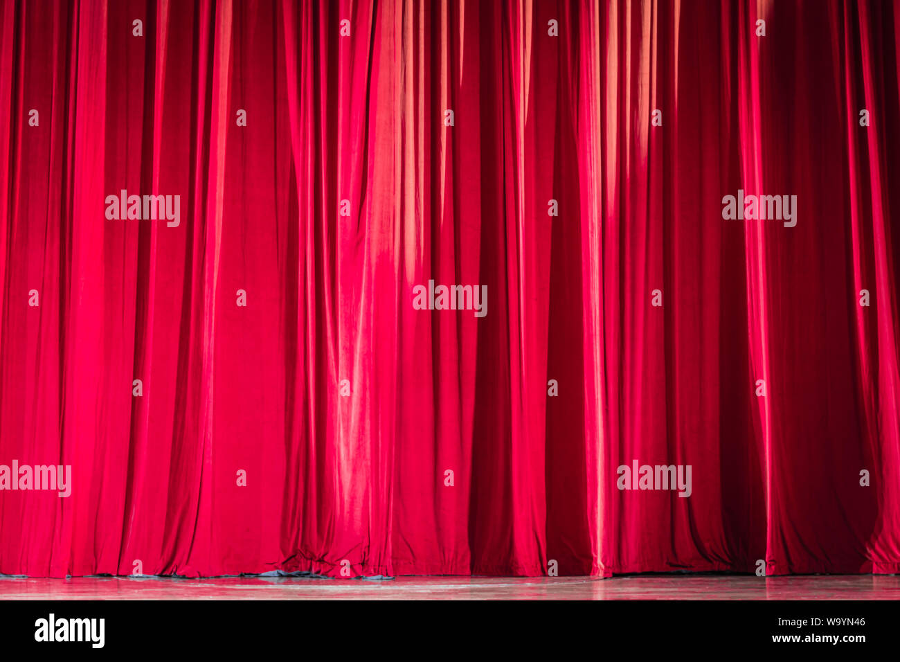 Red curtains in a theater scene of the show Stock Photo - Alamy