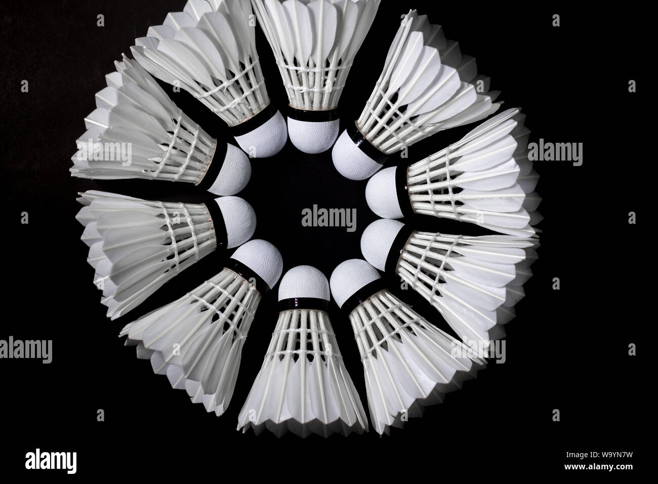 Shuttlecock in a badminton tournament on a black background Stock Photo ...