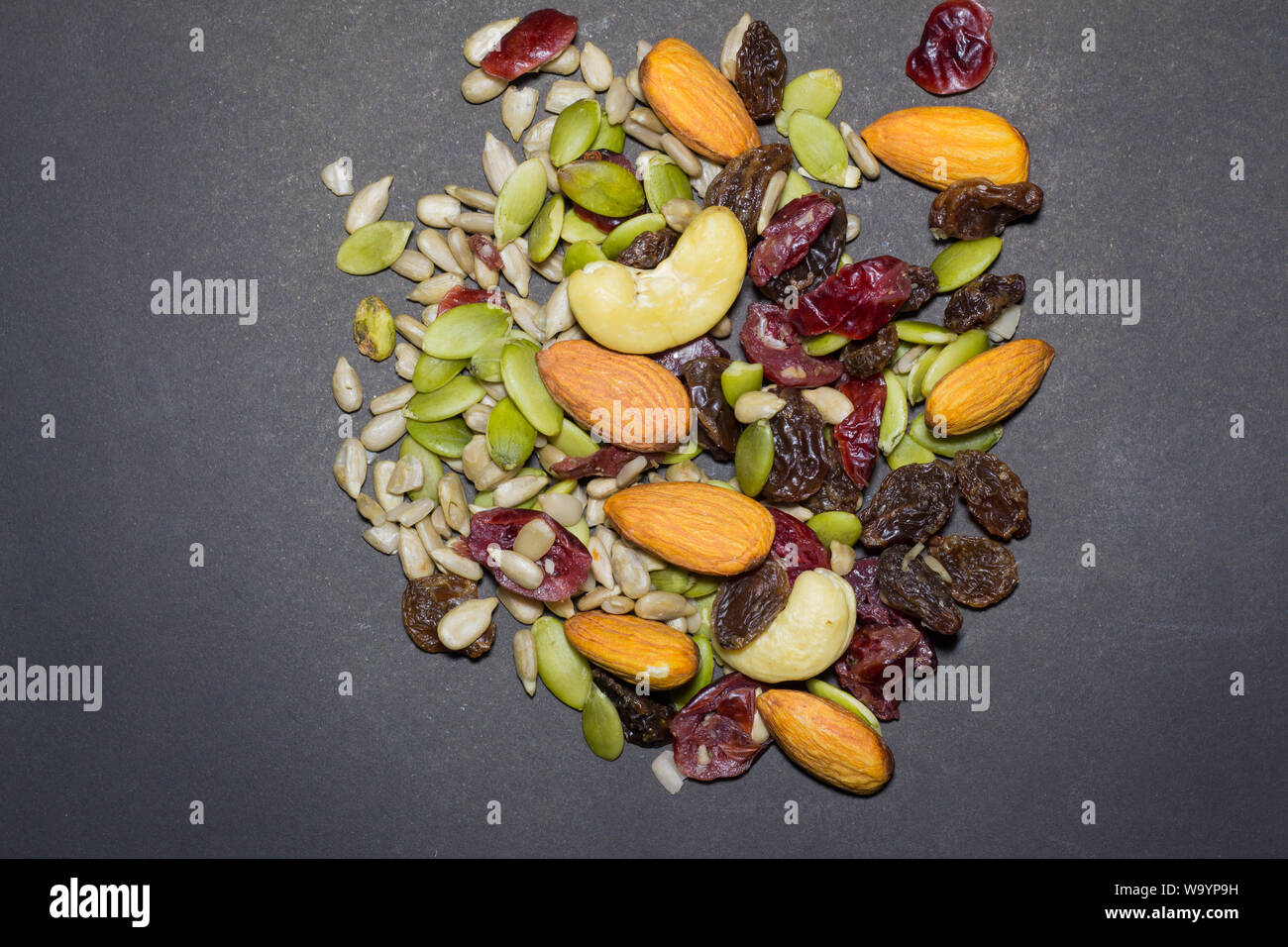 Trail mix on the black background. Trail mix background Stock Photo - Alamy