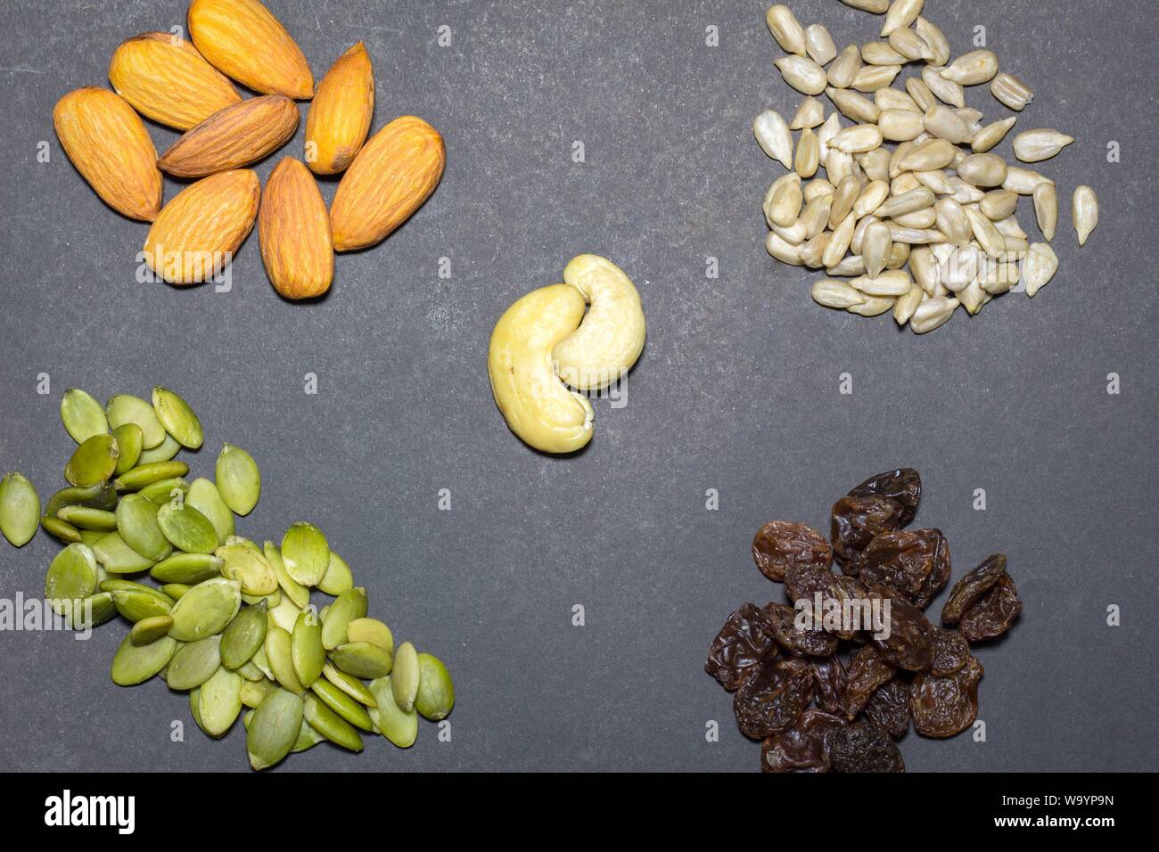 Trail mix on the black background. Trail mix background Stock Photo - Alamy