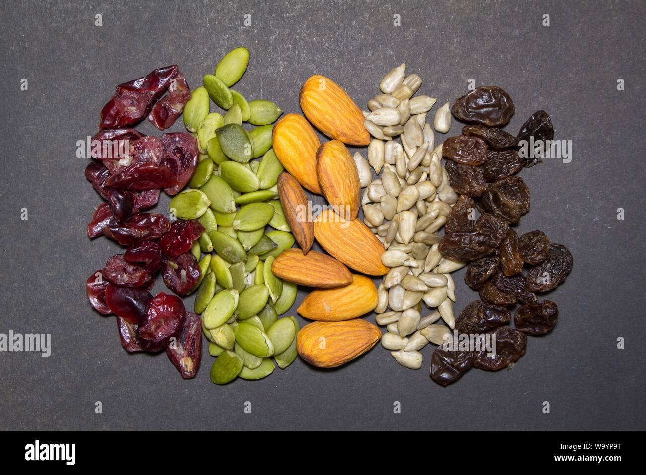 Trail mix on the black background. Trail mix background Stock Photo - Alamy