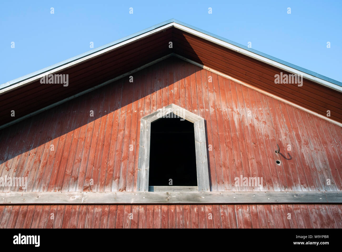 open hatch on old red wooden building wall Stock Photo - Alamy