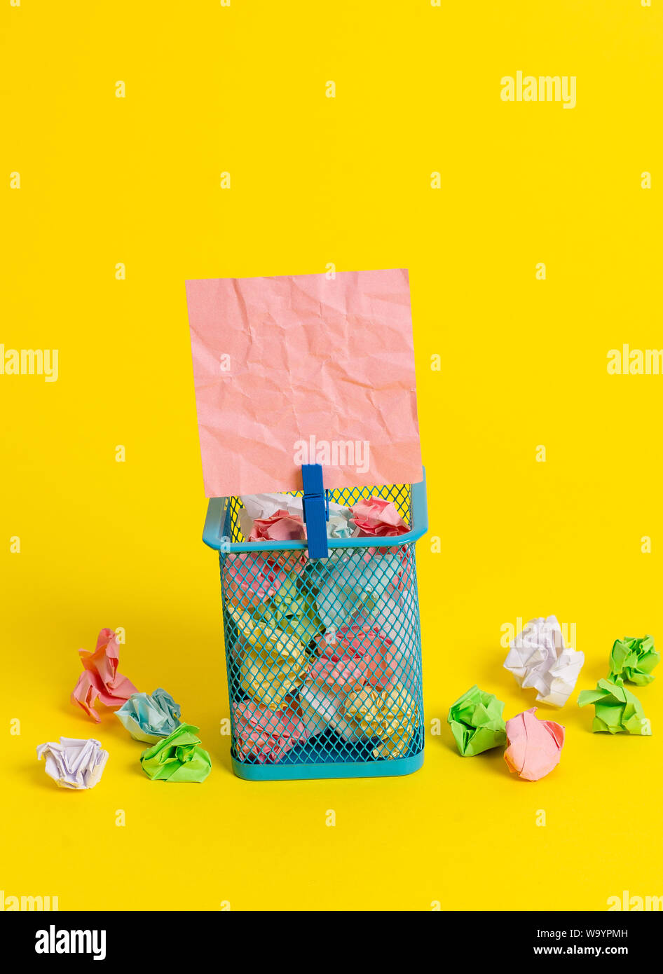 Trash bin crumpled paper clothespin empty reminder office supplies ...