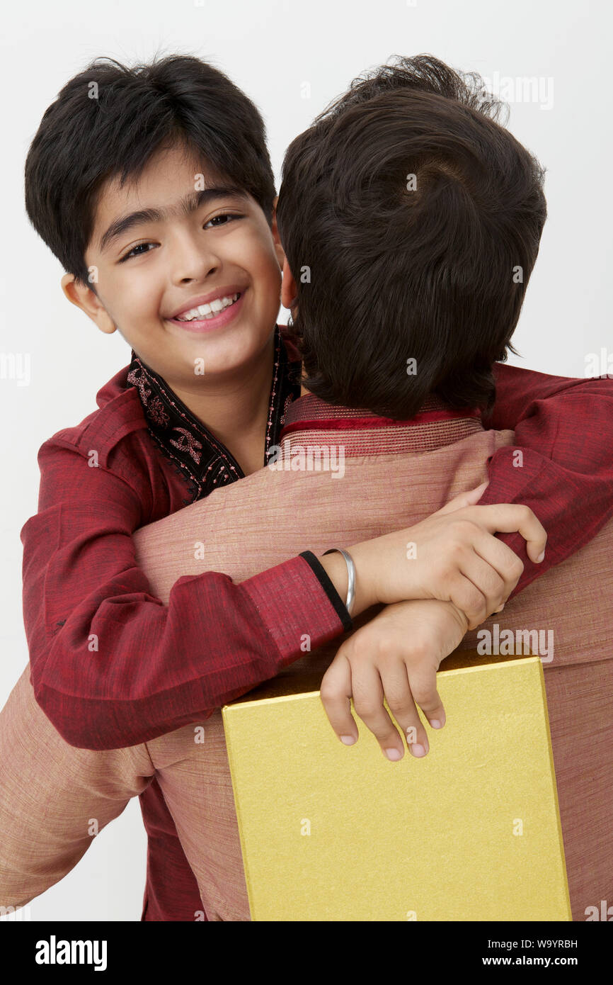Indian father hugging young son hi-res stock photography and images - Alamy