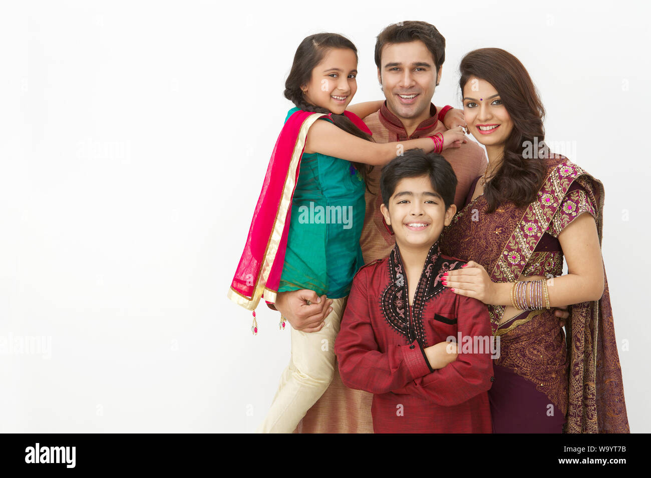 Family standing together Stock Photo - Alamy
