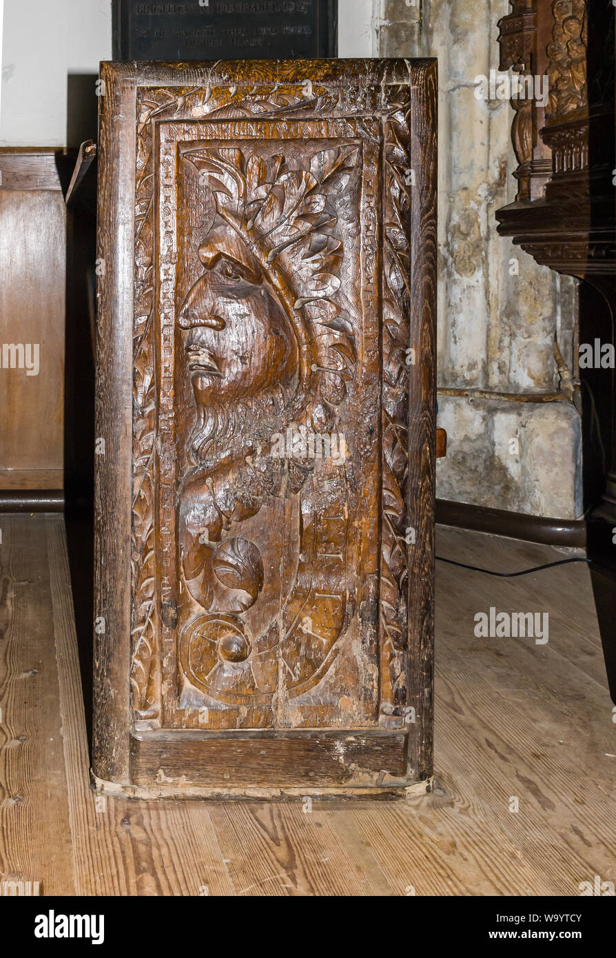 Medieval red indian bench end. All Saints, East Budleigh Stock Photo ...