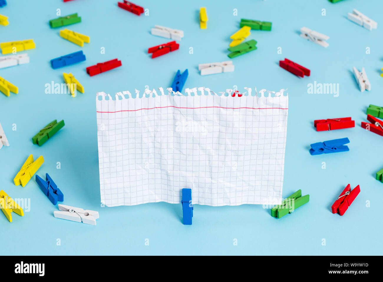 Colored clothespin papers empty reminder blue floor background office ...