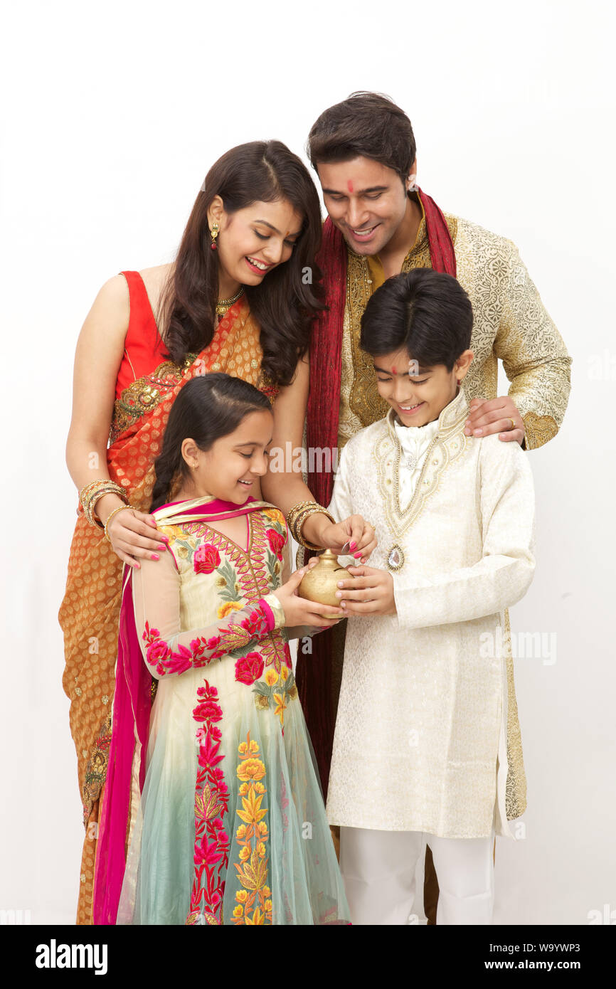 Family celebrating Diwali and collecting money Stock Photo - Alamy