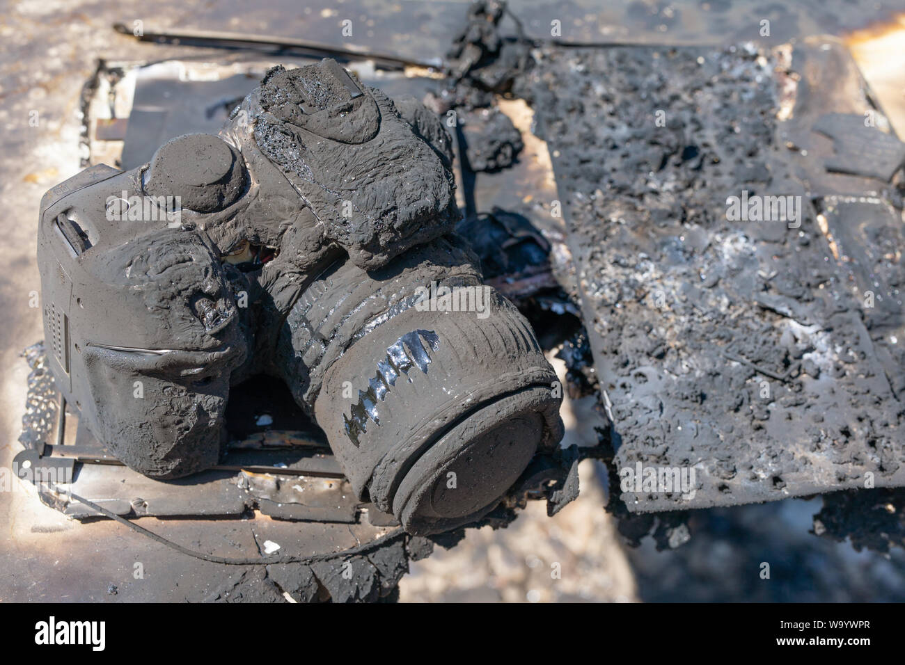 consequences of a fire. insurance case. Burnt, broken camera. insured ...
