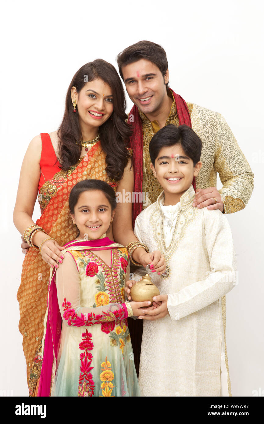 Family celebrating Diwali and collecting money Stock Photo - Alamy