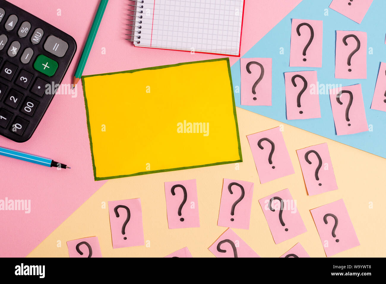 Mathematics stuff and writing equipment above pastel colours background ...