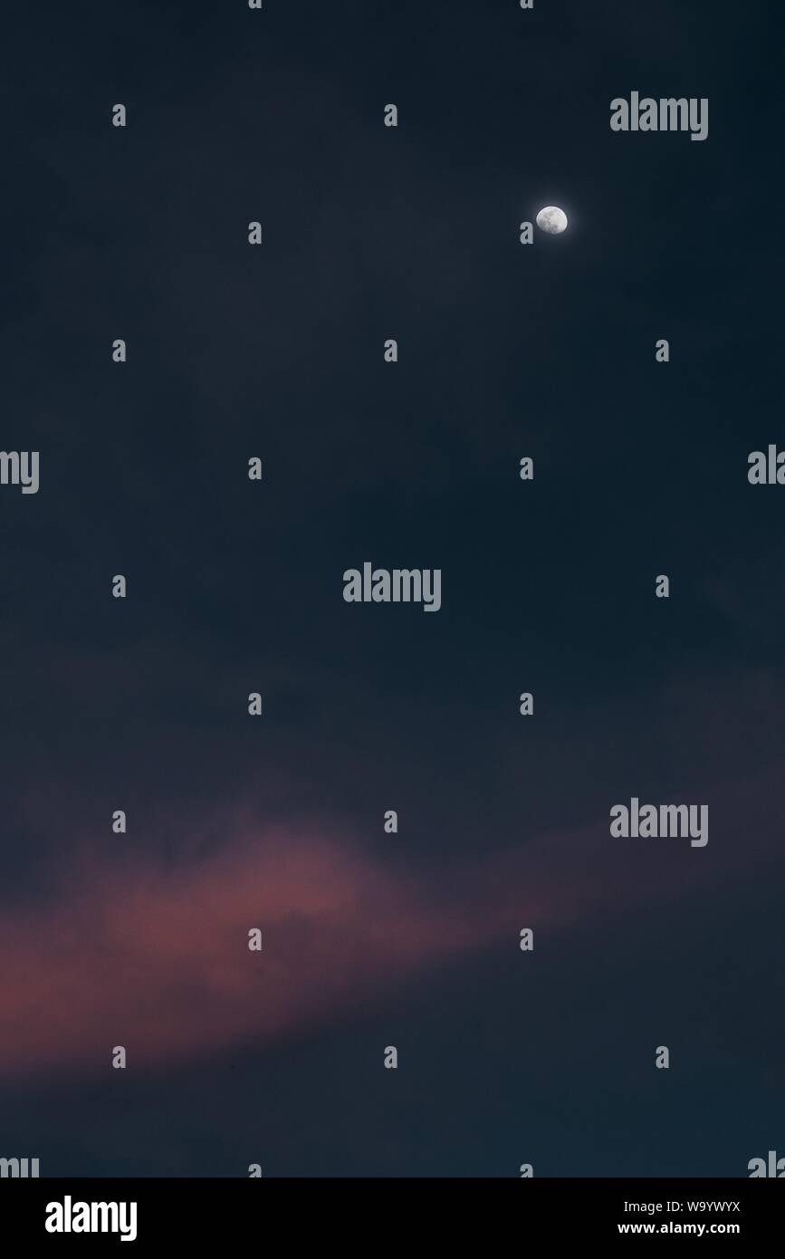 Beautiful vertical shot of a full moon in a night sky Stock Photo - Alamy