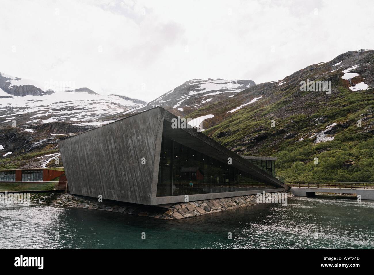 Shot of Trollstigen Visitor Center near mountains in Norway Stock Photo ...