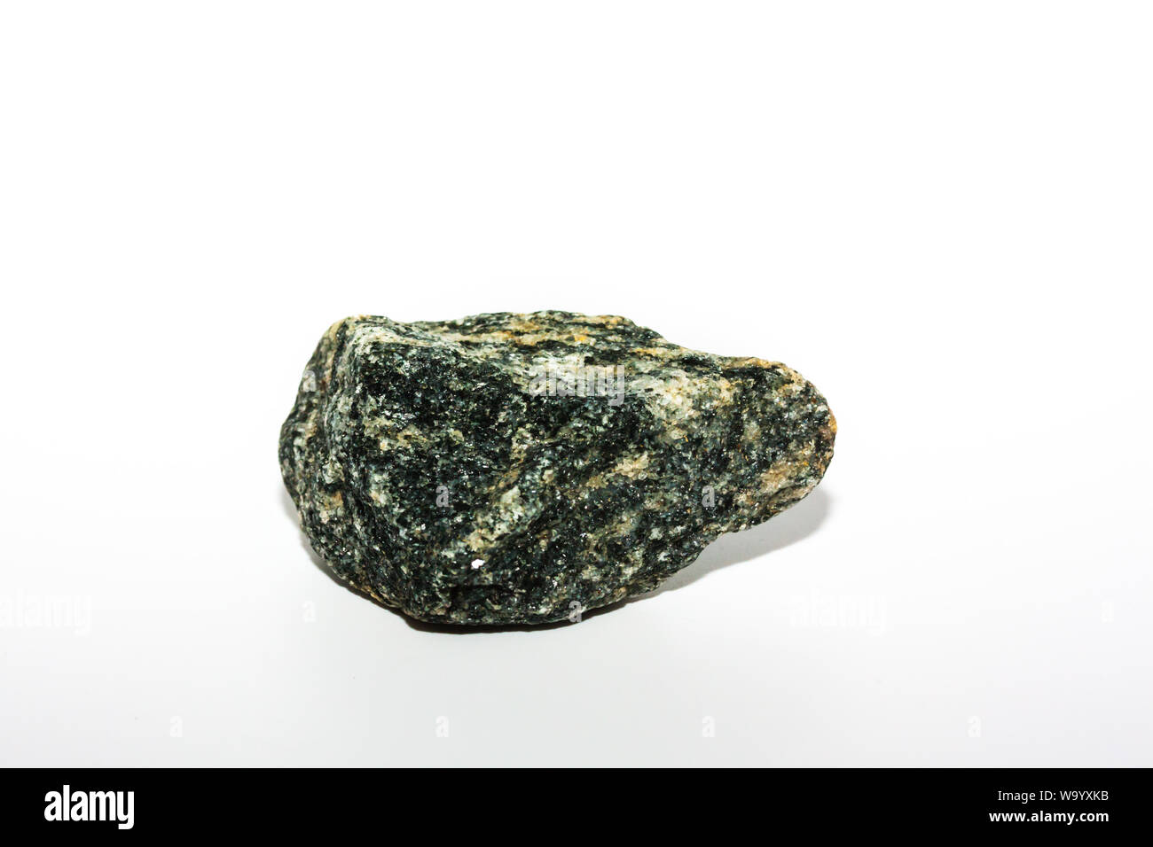 Natural green stone isolated on white background Stock Photo - Alamy