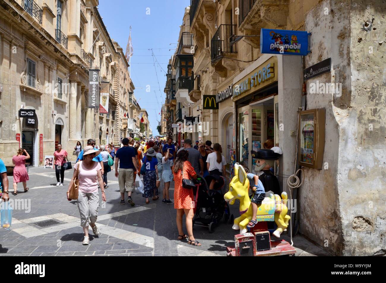shops and cafes and tourists on republic street valletta malta Stock ...
