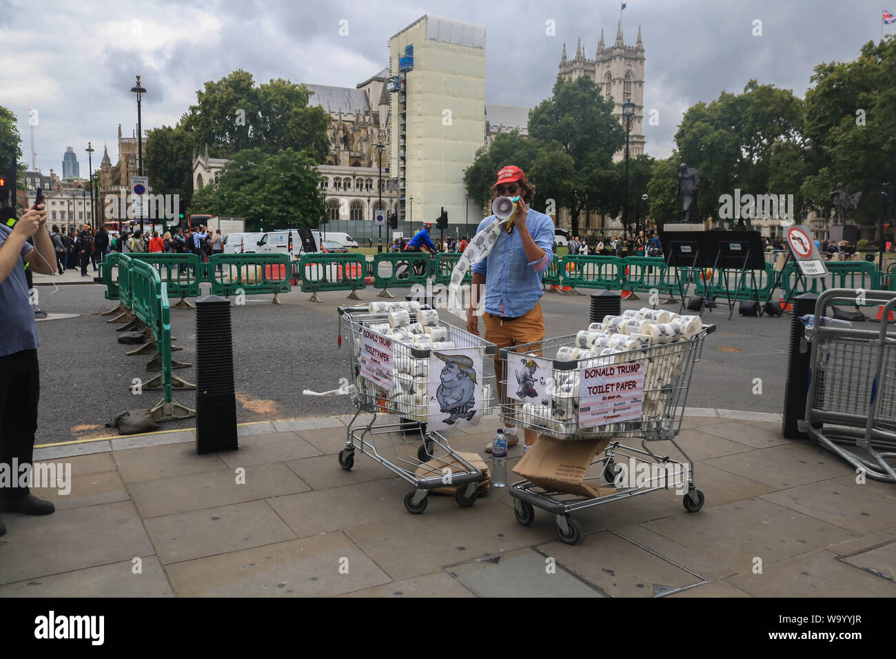 London UK 16th August 2019. A man selling toilet paper with printed ...