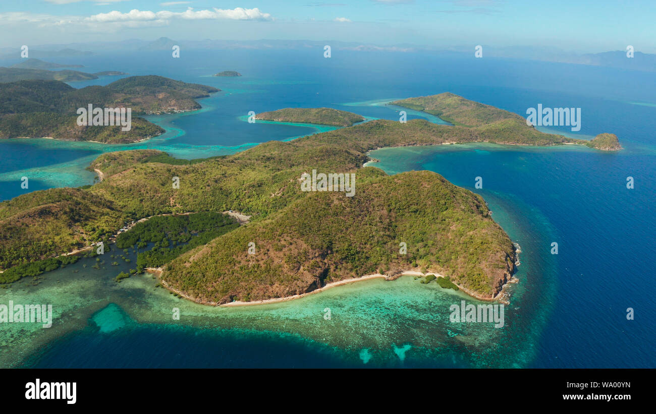 aerial view tropical islands with blue lagoons, coral reef and sandy ...