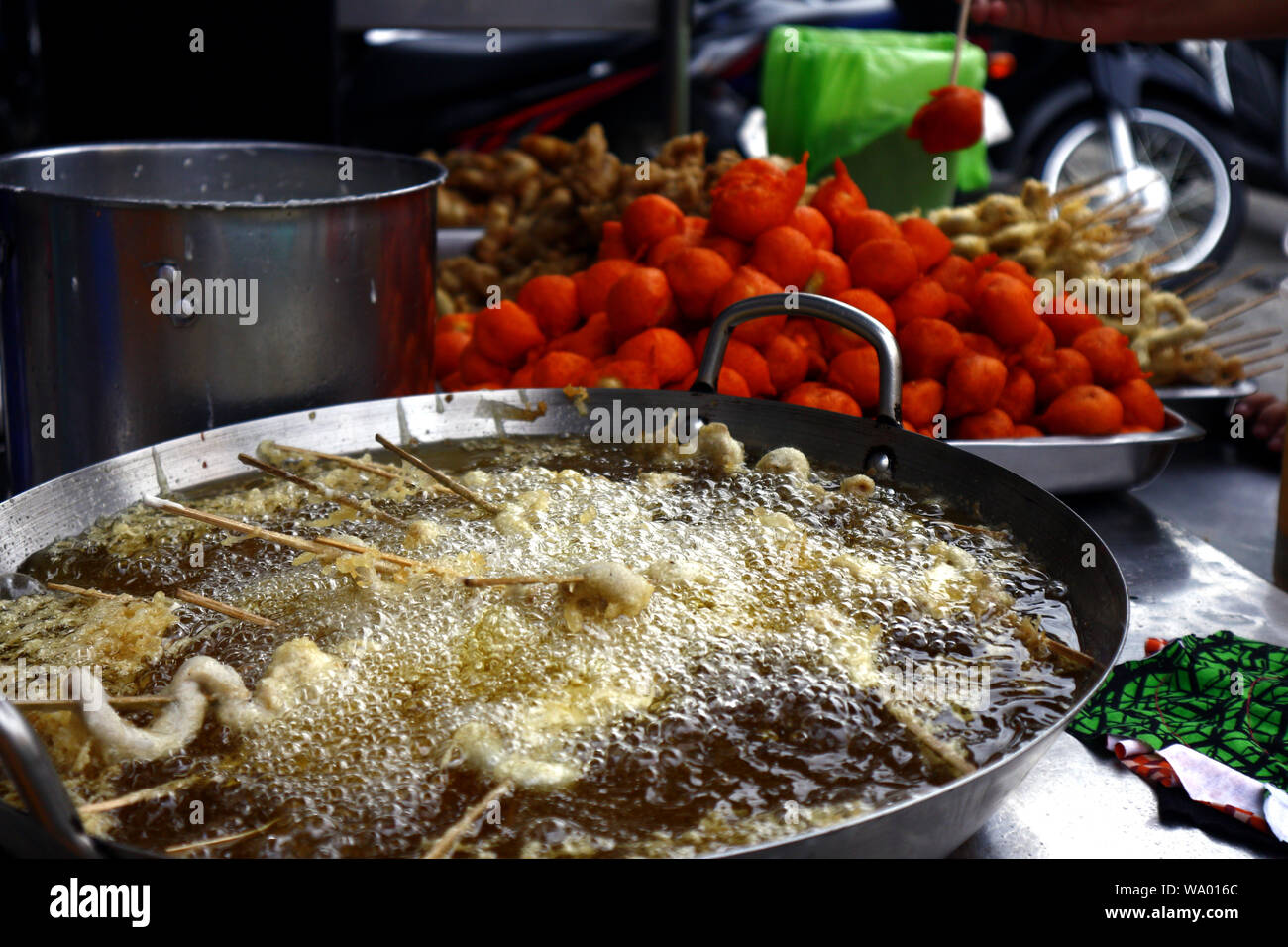 Photo of assorted fried street food at a street food cart Stock Photo ...