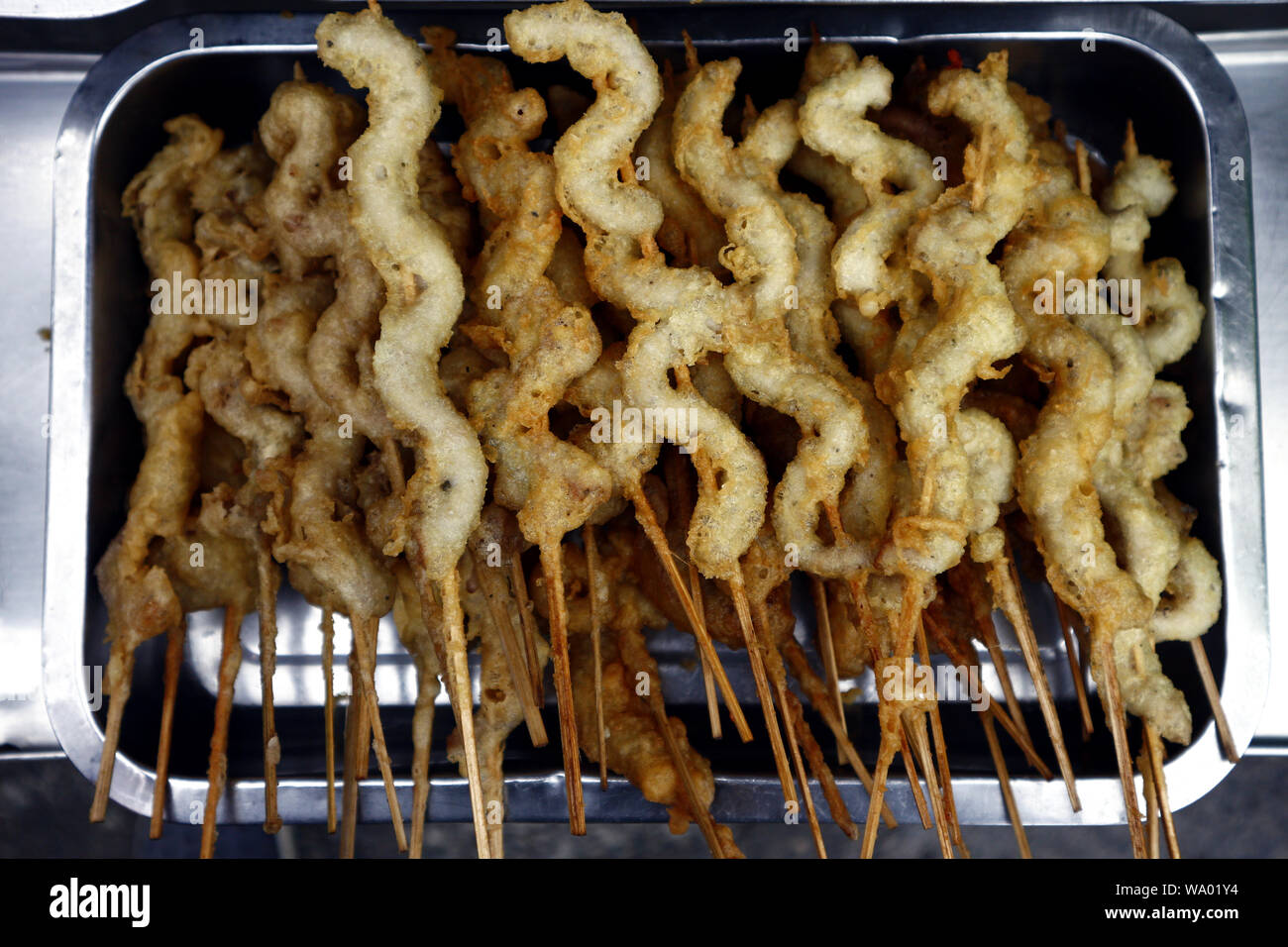 Photo of deep fried chicken intestine in barbecue sticks Stock Photo ...