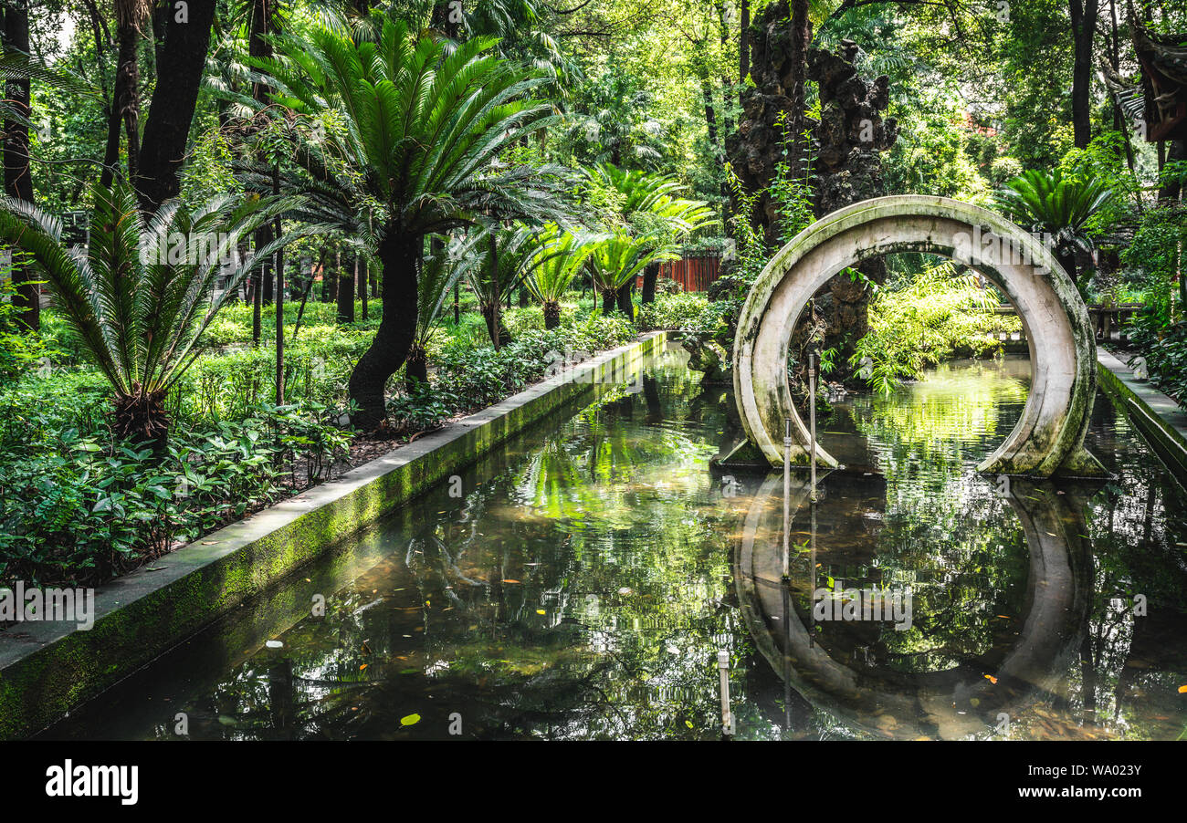 Scenic view of a traditional Chinese garden with water pound at the ...