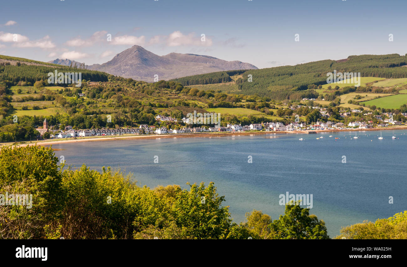 Houses cluster on the shore of Lamlash Bay under the mountains of ...