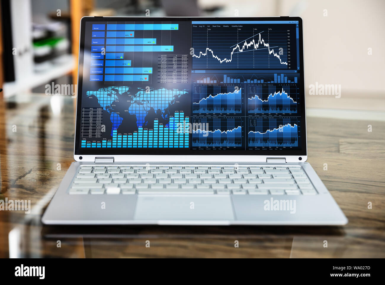 Close-up Of Laptop Computer Showing Graph On Office Desk Stock Photo ...