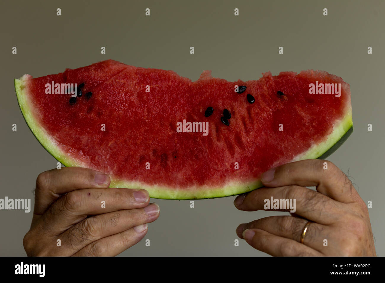 Male hand holding fresh watermelon hi-res stock photography and images ...