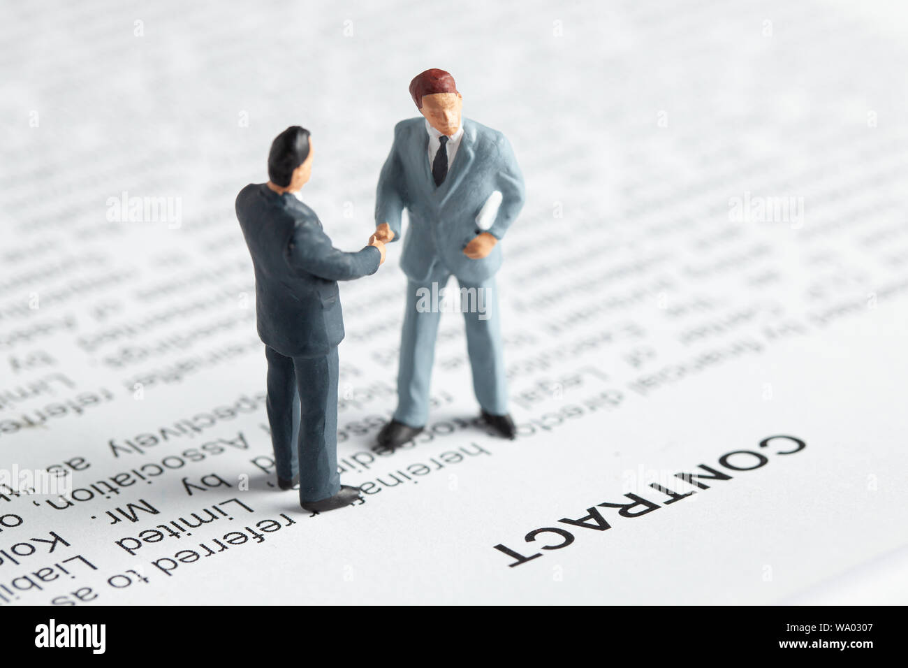 Businessmen shake hands as sign of the successful signing of the ...