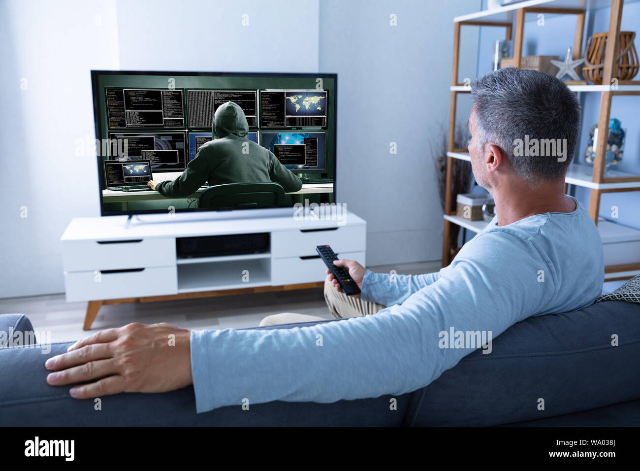 Old man watching tv hi-res stock photography and images - Alamy