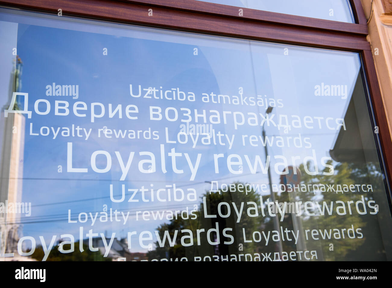 RIGA, LATVIA. 16th August, 2019. Slogan "Loyalty rewards" on window of ...