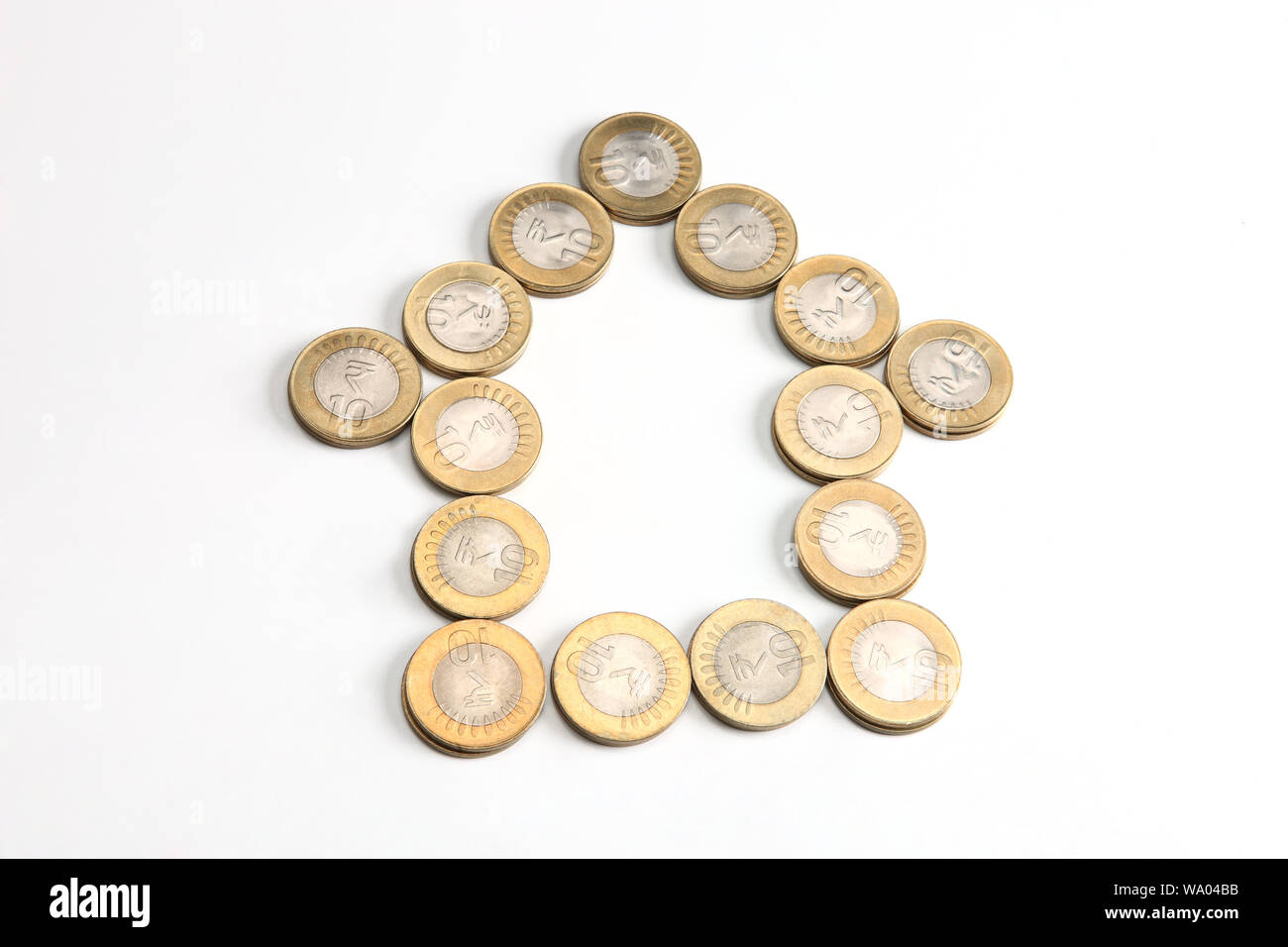 Coins forming the shape of a house Stock Photo - Alamy