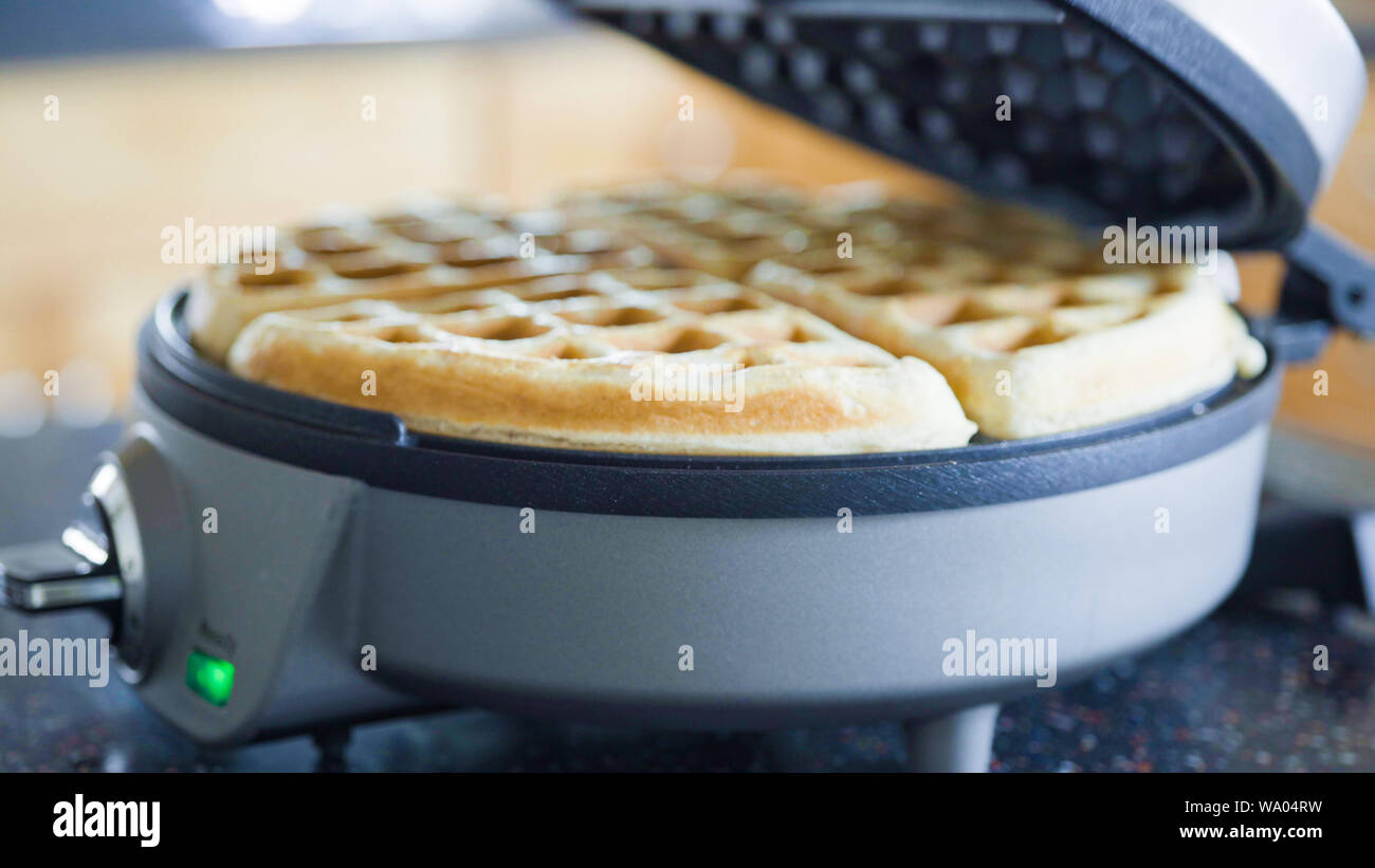 Making homemade waffles in an electric waffle maker Stock Photo - Alamy