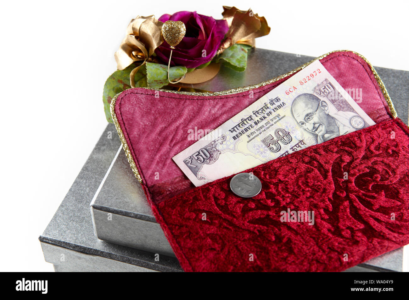 Purse with banknote on the stack of gift boxes Stock Photo - Alamy