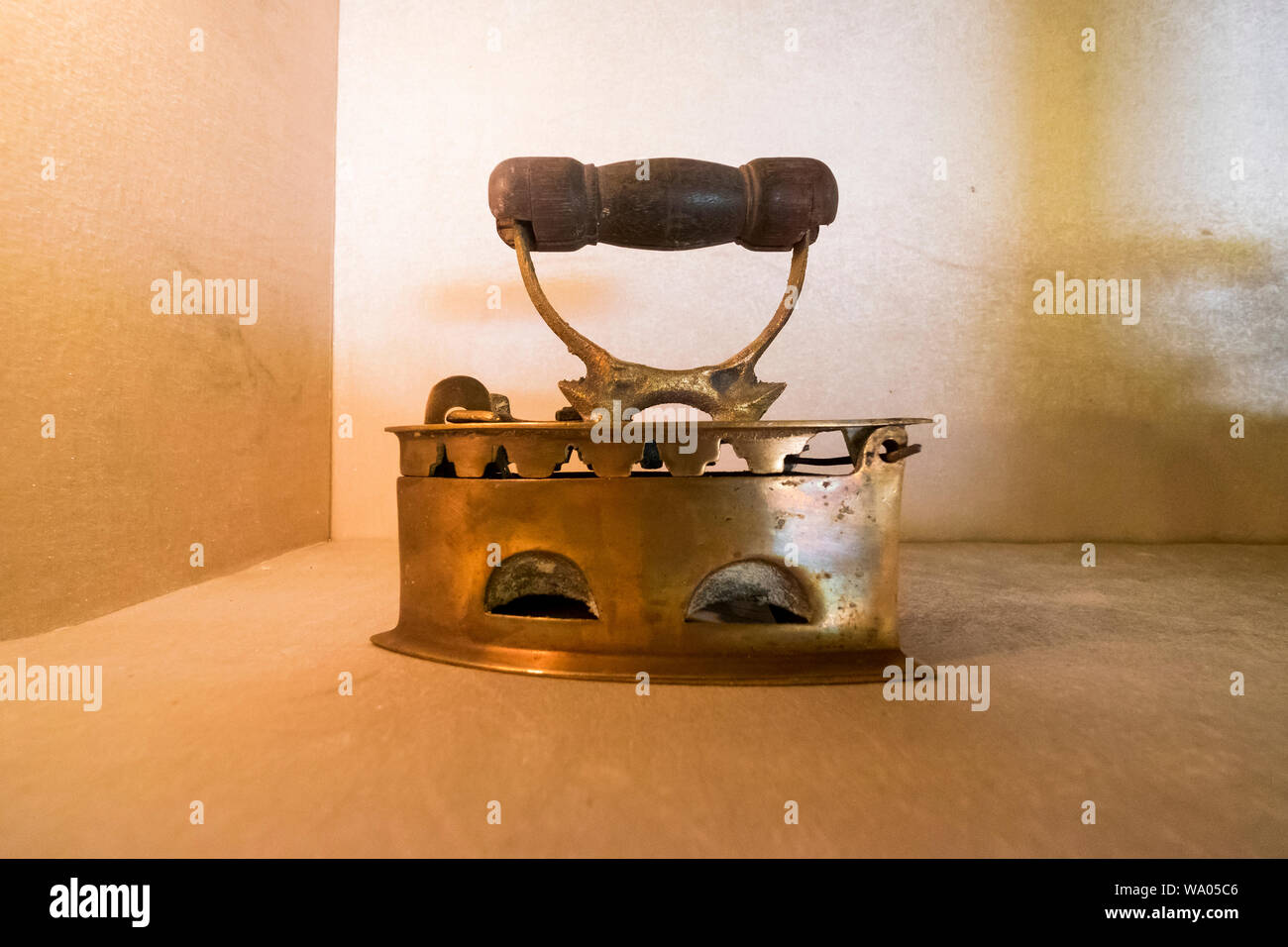 An old, wood, coal fired iron on display at the Jahar Palace, former ...