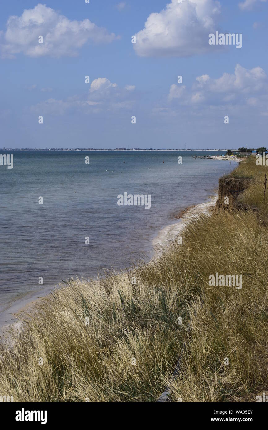 Steep cliff, seashore landscape. Cliff of clay and sea beach. Beautiful ...