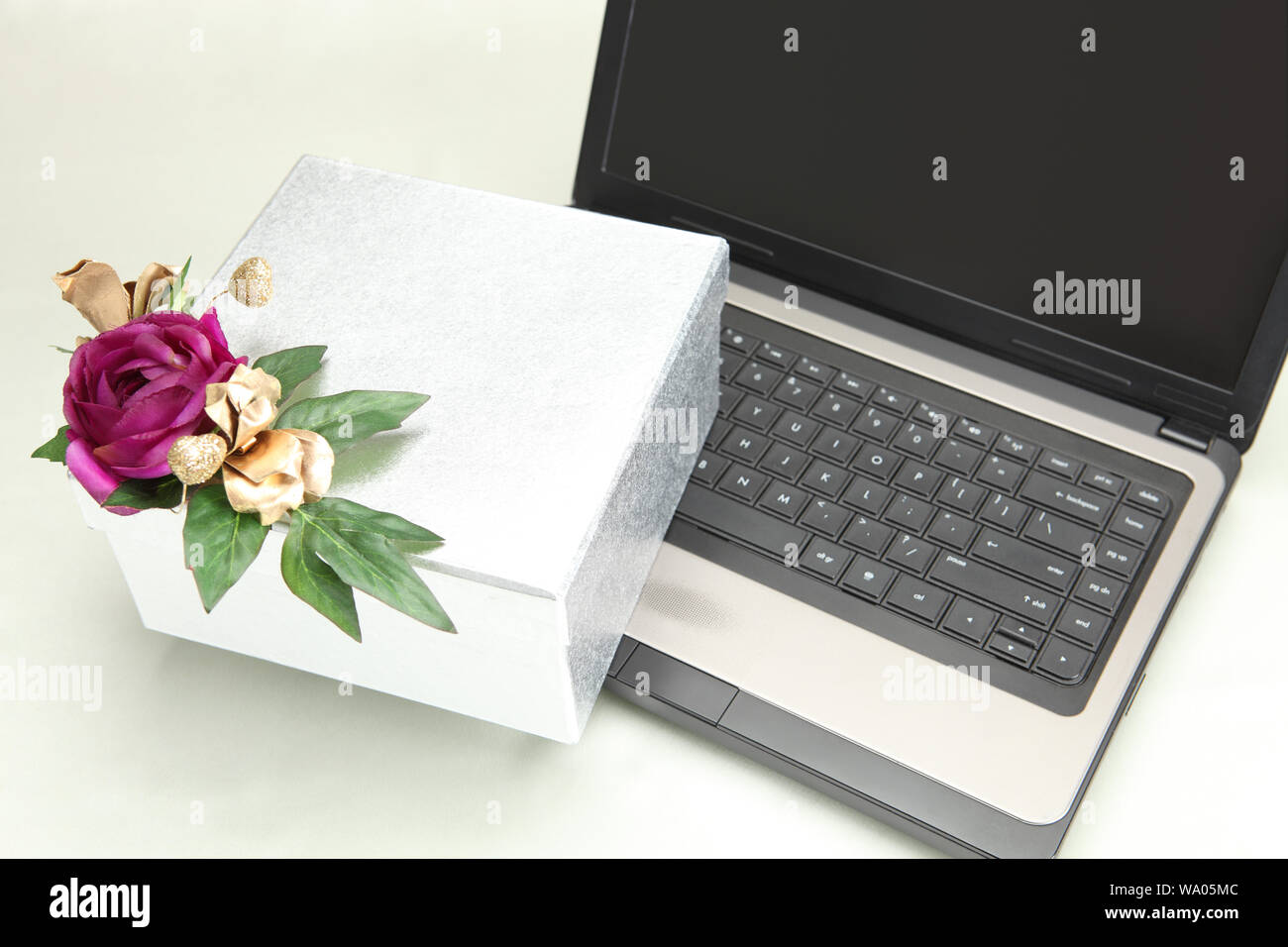 Gift box on a laptop Stock Photo - Alamy