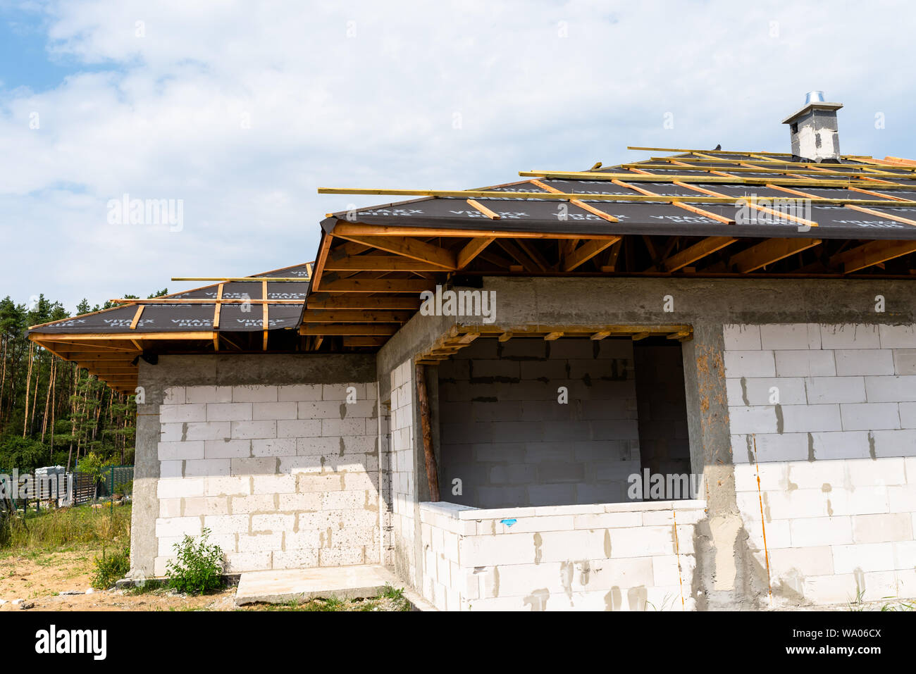 Roof trusses covered with a membrane on a detached house under ...