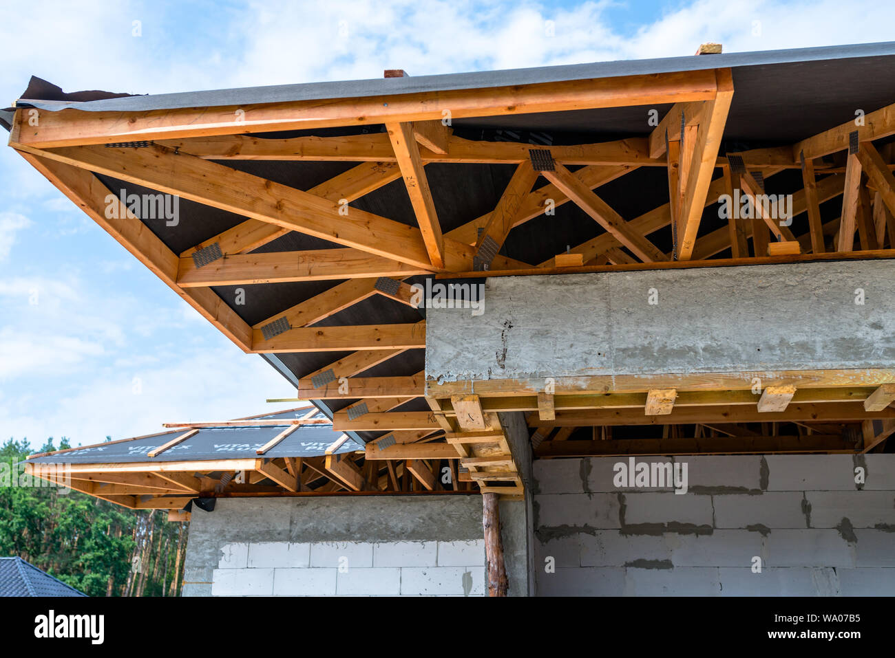 Roof trusses covered with a membrane on a detached house under ...