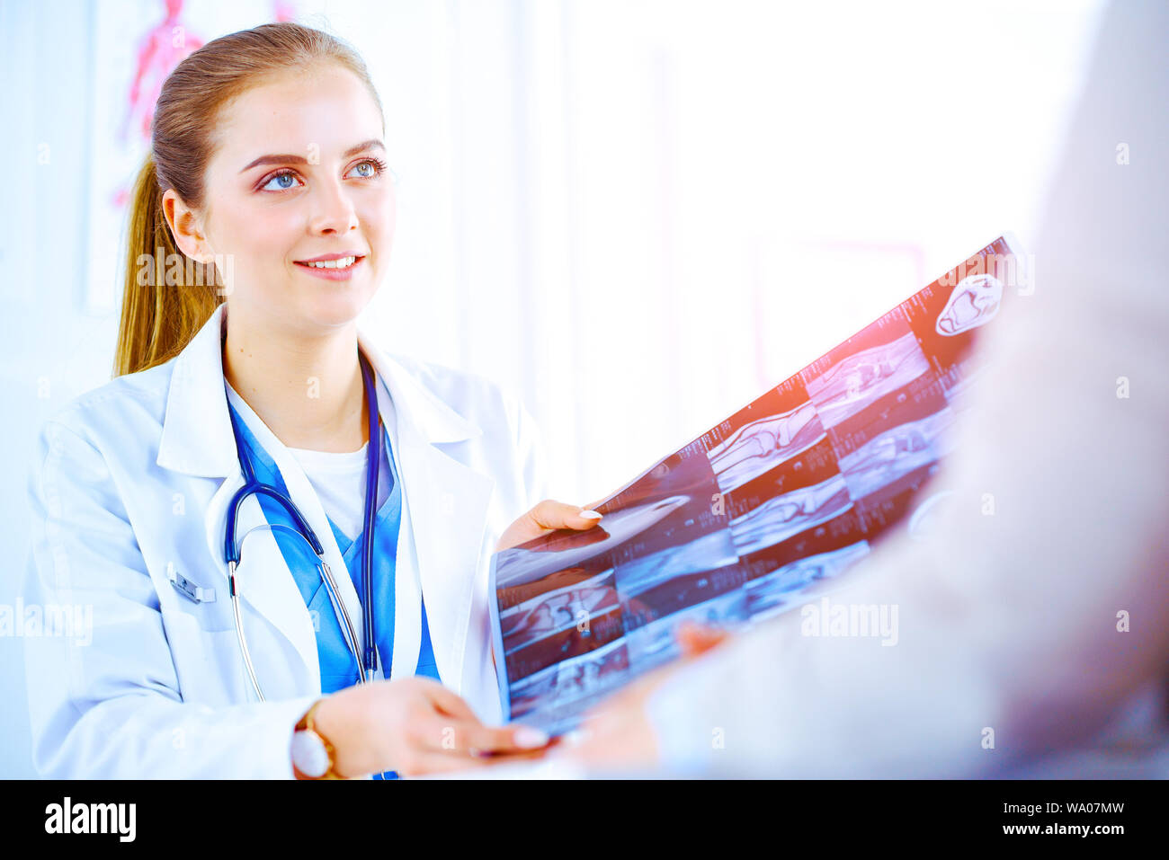 Female physician explaining symptoms patient hi-res stock photography ...