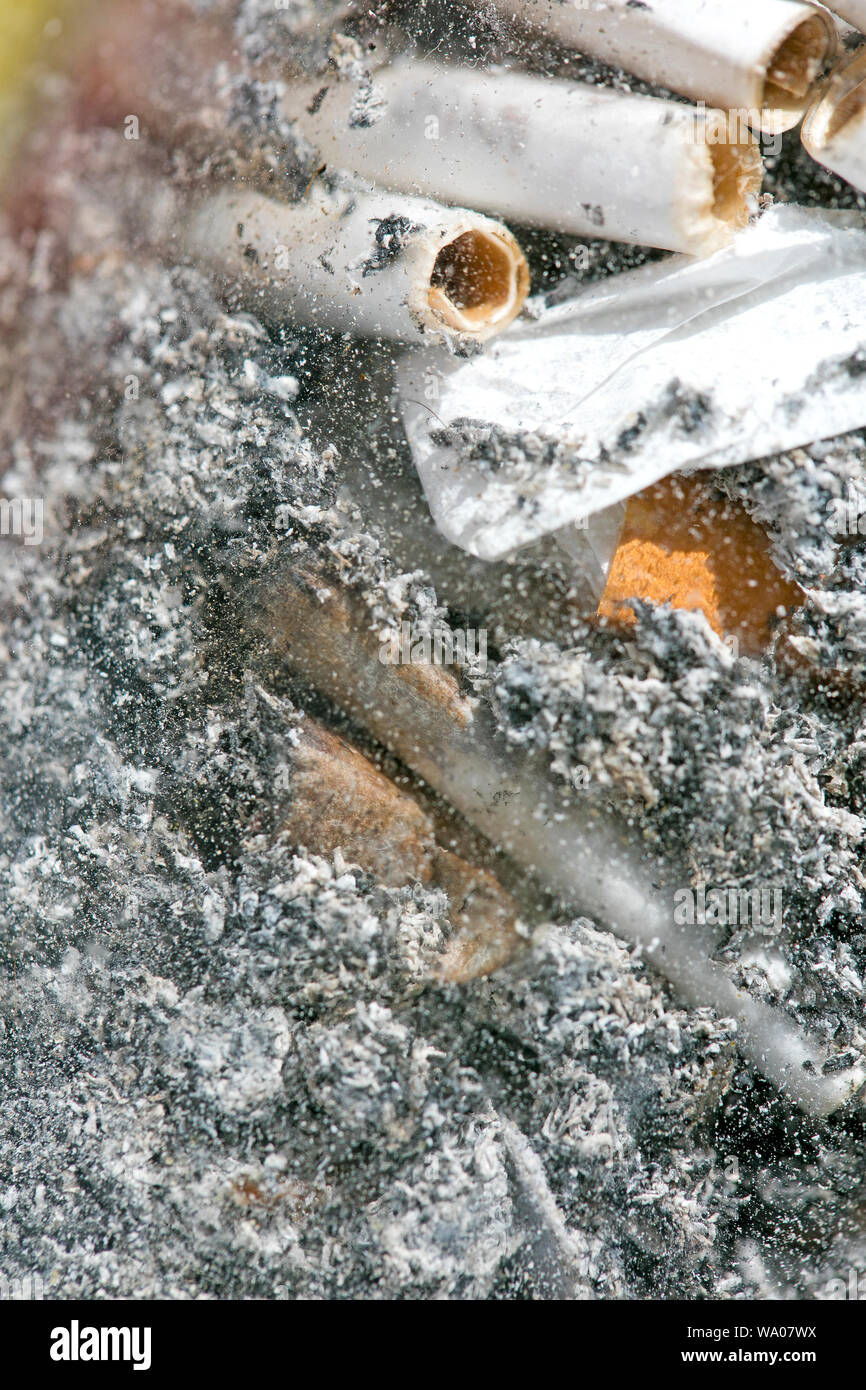 Ashes and joins from medical cannabis in glass macro background fifty ...