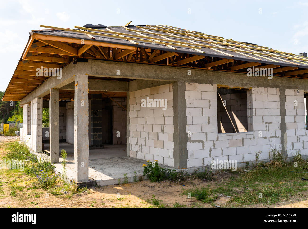 Roof trusses covered with a membrane on a detached house under ...
