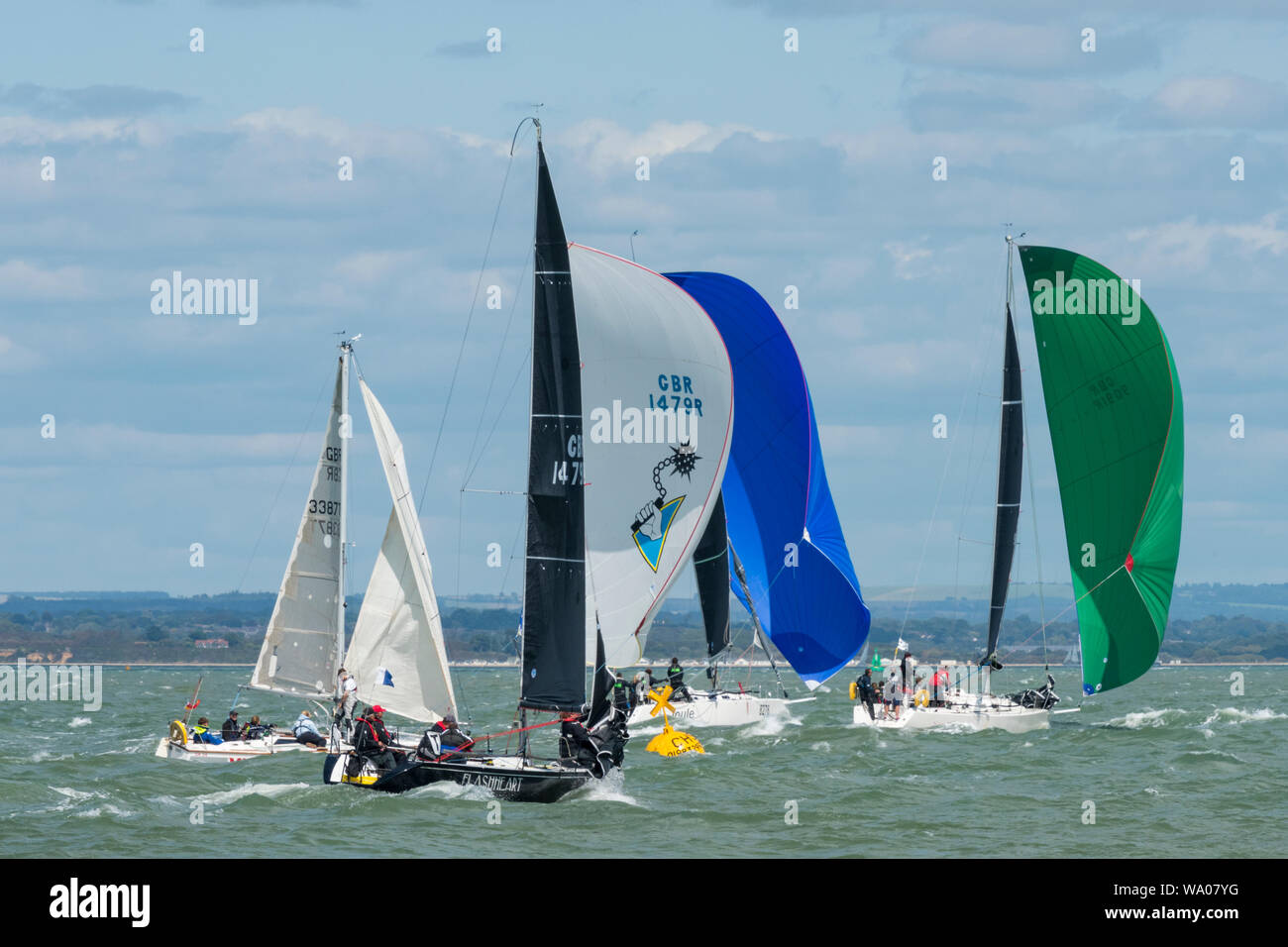 yachts racing off of cowes on the isle of wight during the annual cowes ...