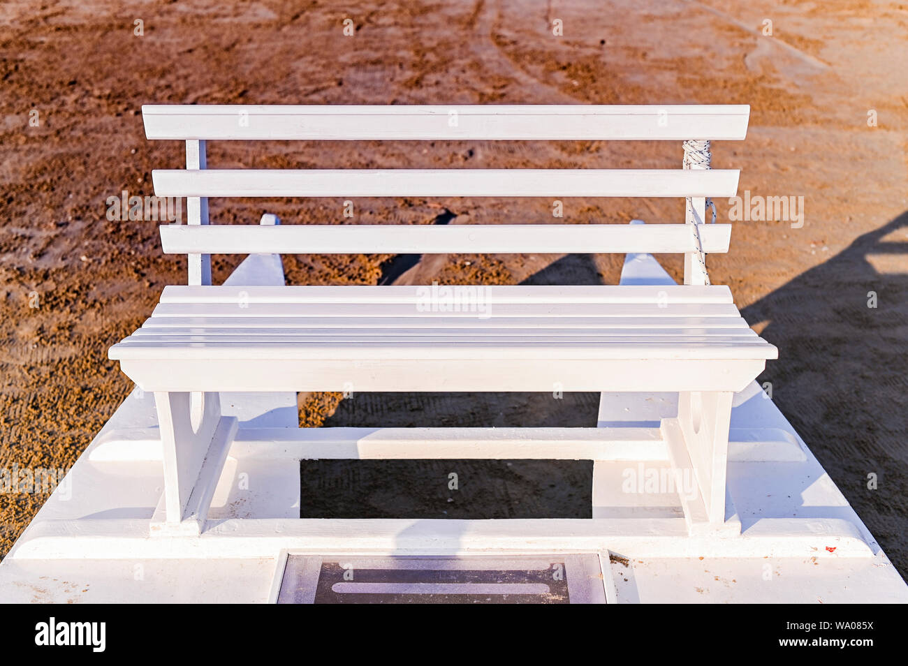 White wooden bench on the beach. Natural lighting street photo. Free ...