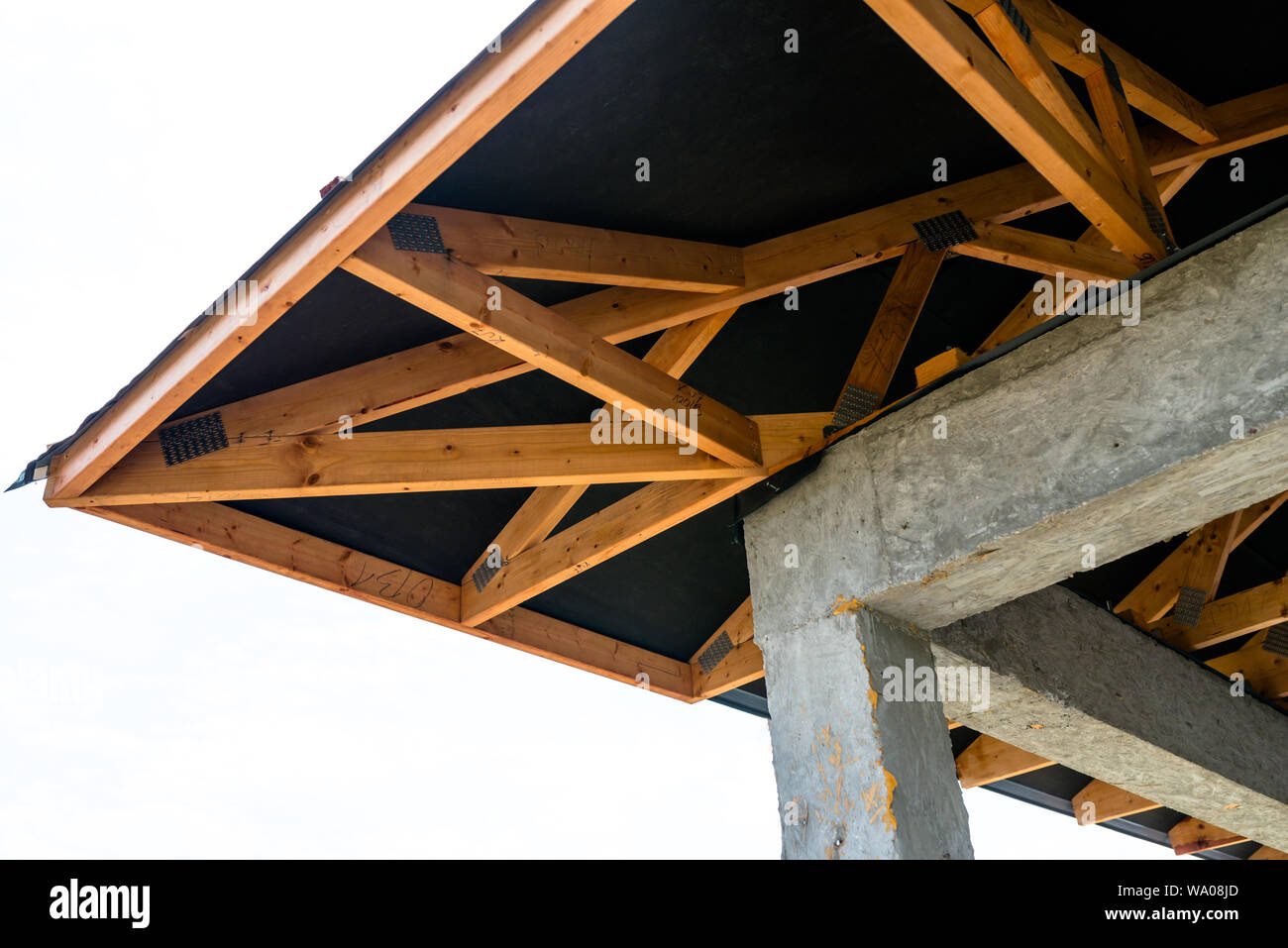 Roof trusses covered with a membrane on a detached house under ...