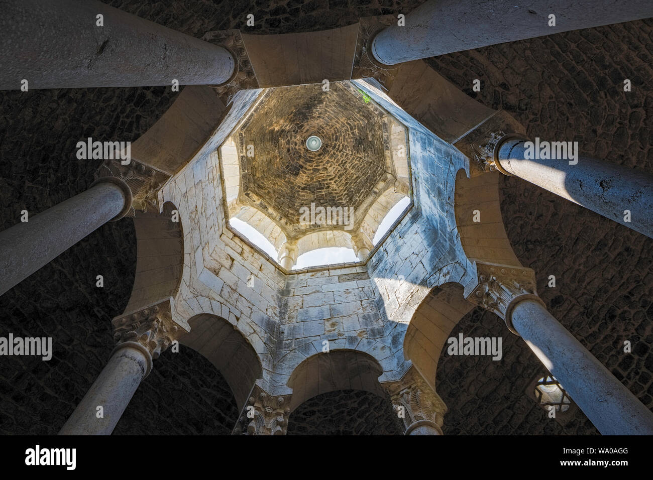 Looking up at the cupola covering the central pool, which is supported ...