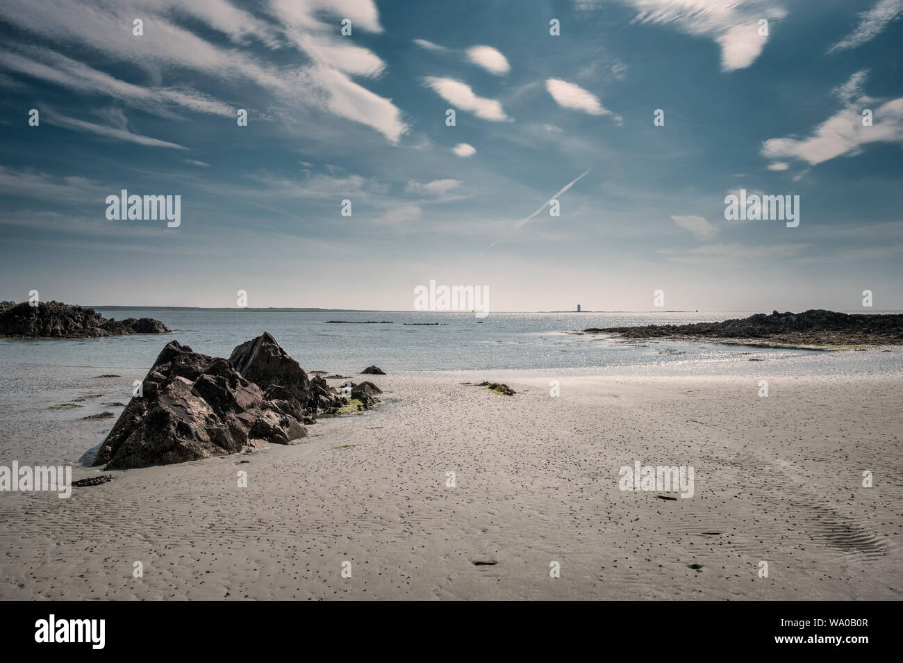 Sandy beach and rocks on Kilclief Beach on Strangford Lough on the west ...
