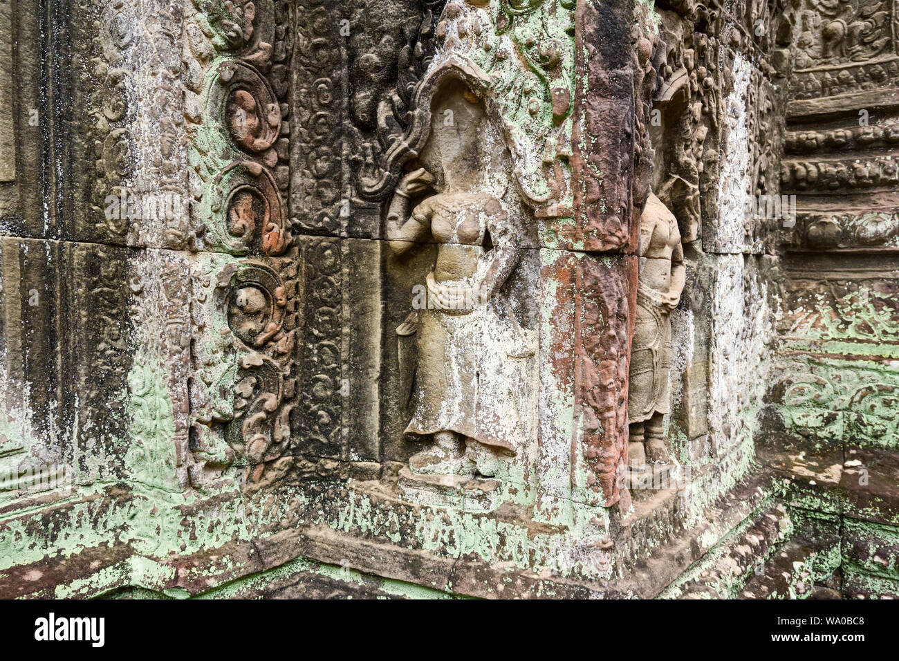 a statue of devata whose face was sliced in Preah Khan temple, Khmer ...