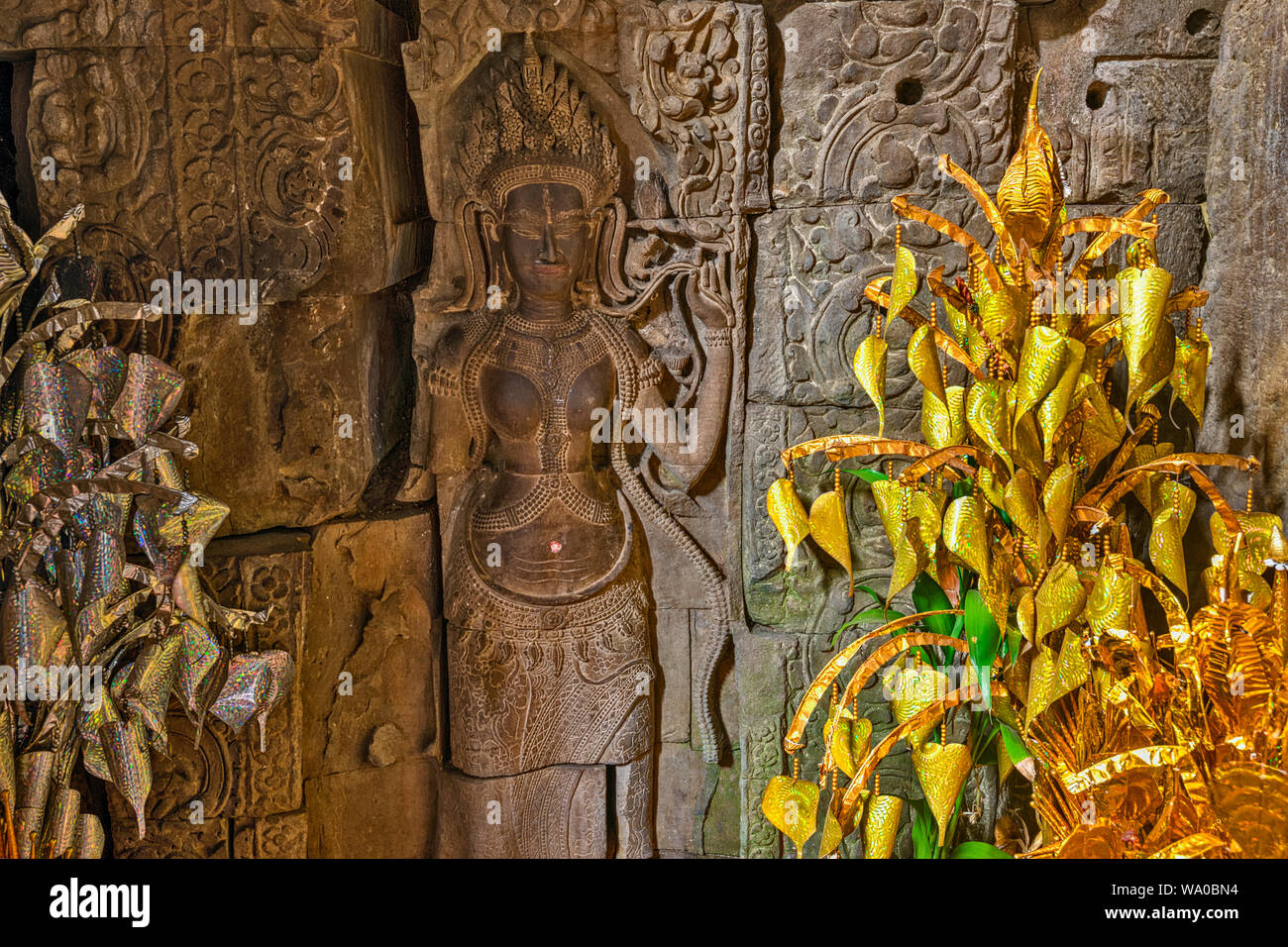 the Queen Indradevi statue inside Preah Khan temple, Khmer ruins in ...