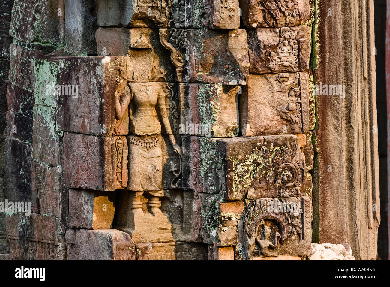 a statue of devata whose face was sliced in Preah Khan temple, Khmer ...