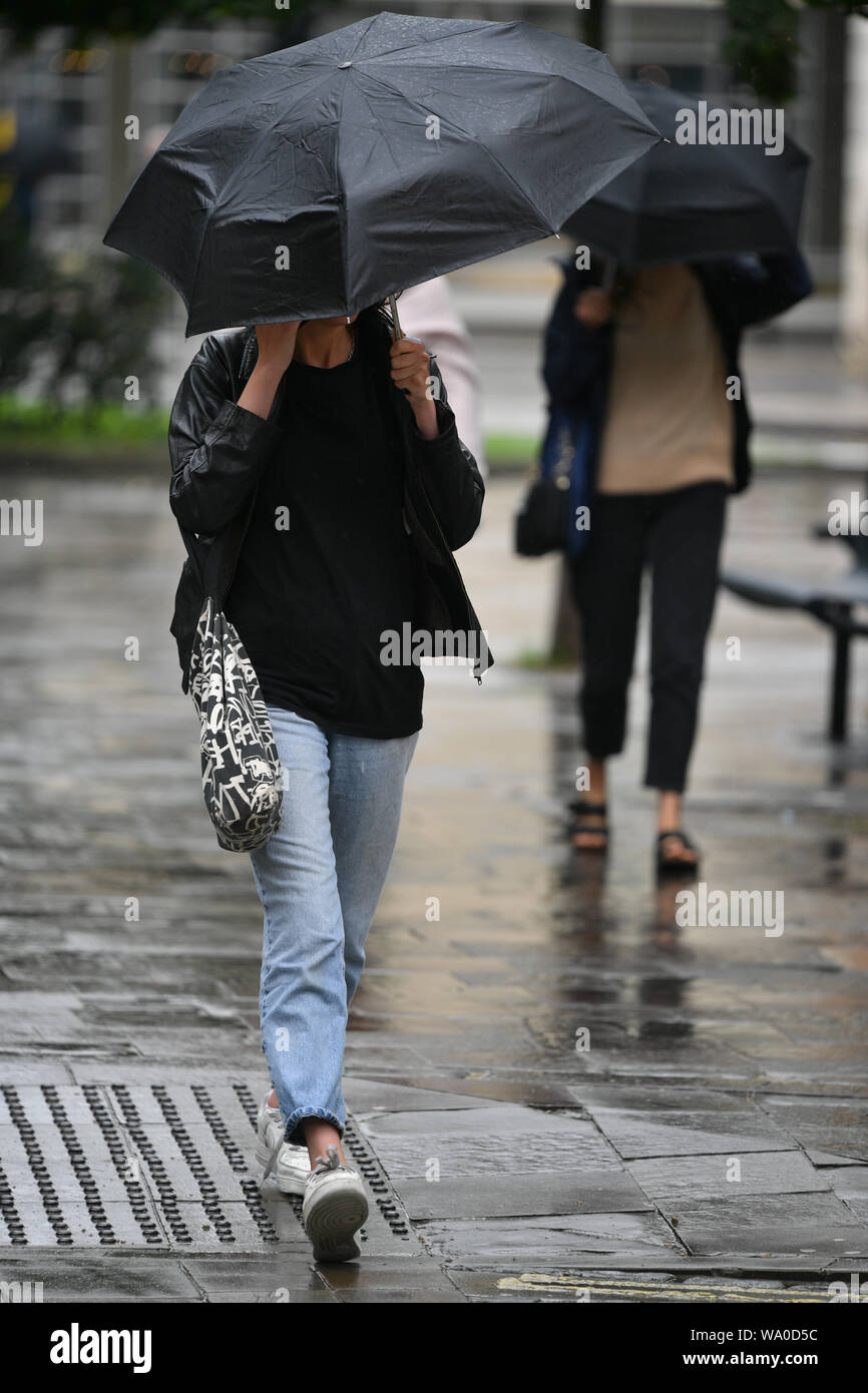 People and umbrellas hi-res stock photography and images - Alamy